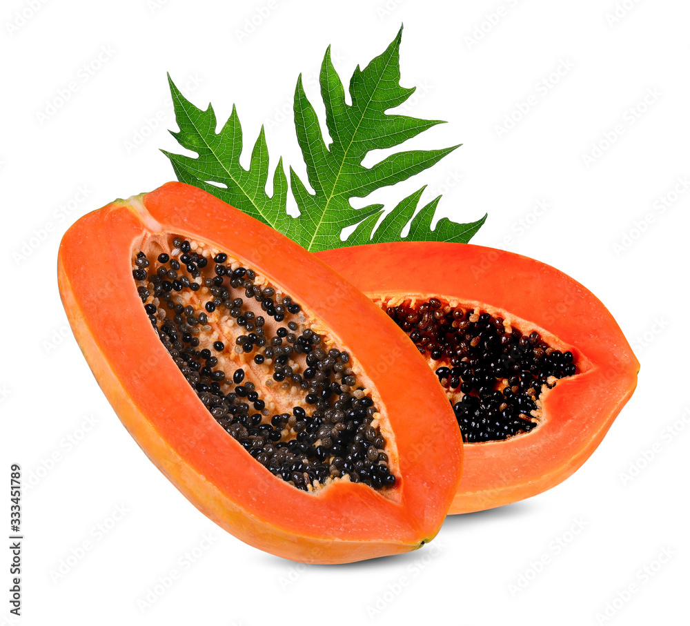Half ripe papaya with seeds and green leaves isolated on white ...