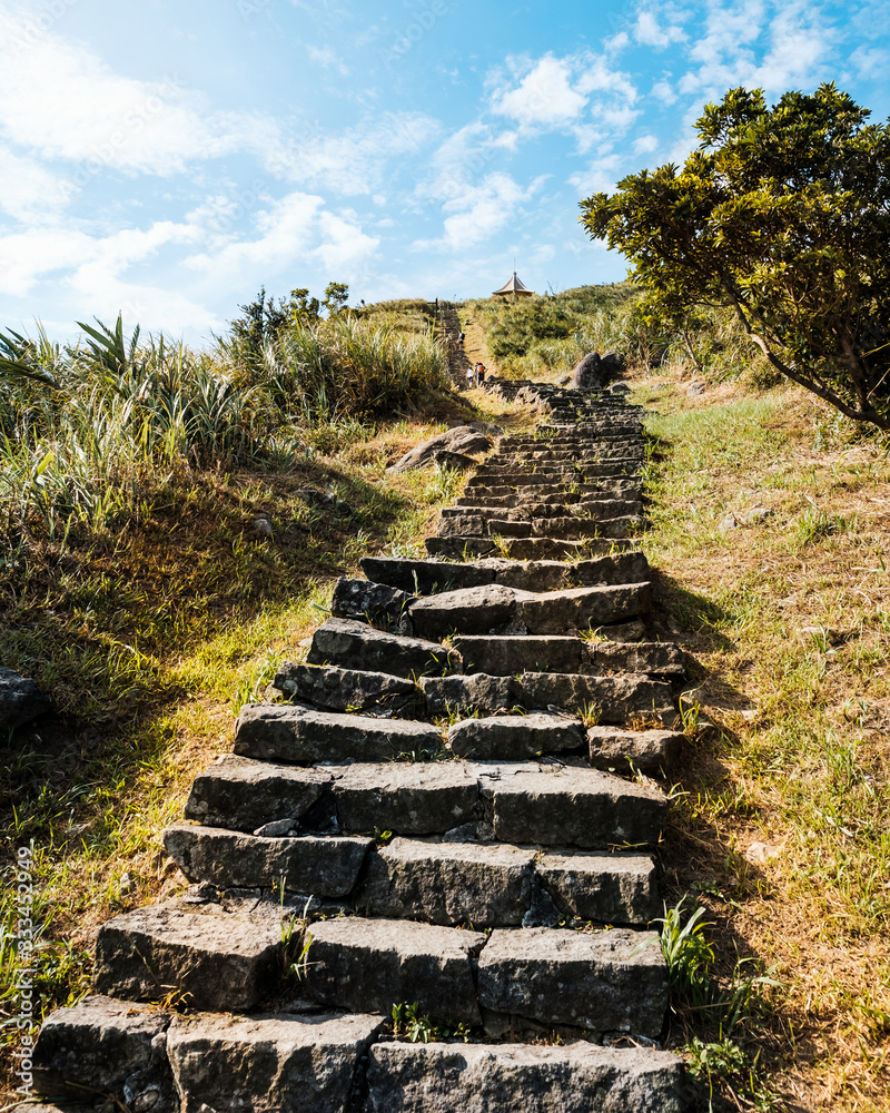 Traditional stairs made of natural stone leading up a hill. Stock Photo ...