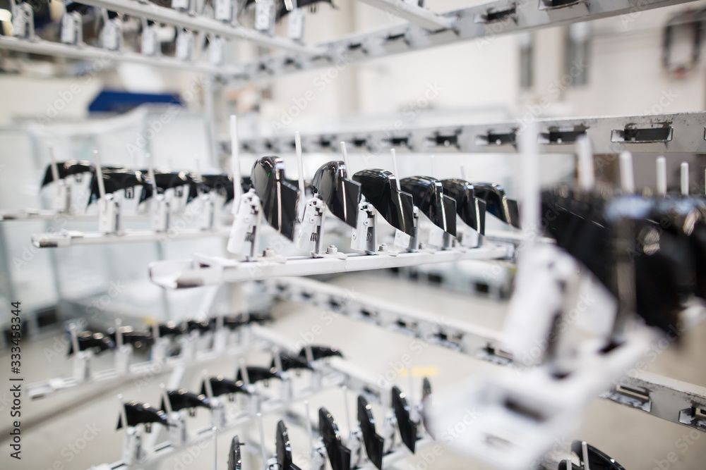 Freshly molded plastic moldings in automotive smart factory, industrial ...