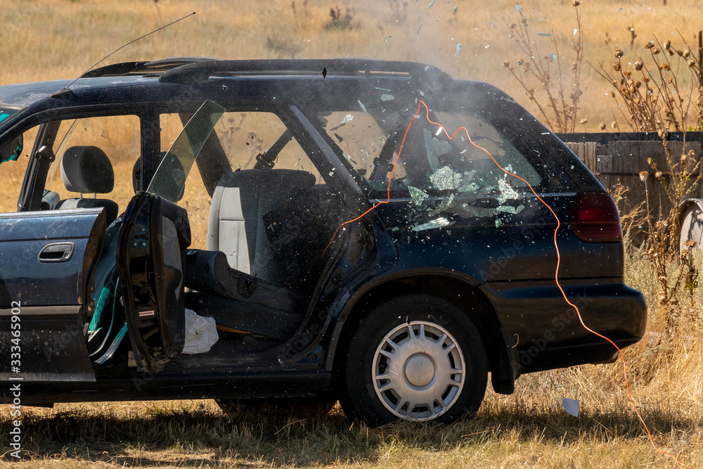 An improvised explosive device is detonated inside of a vehicle using ...
