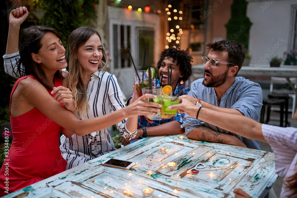 Friends toasting with female celebrant Stock Photo | Adobe Stock