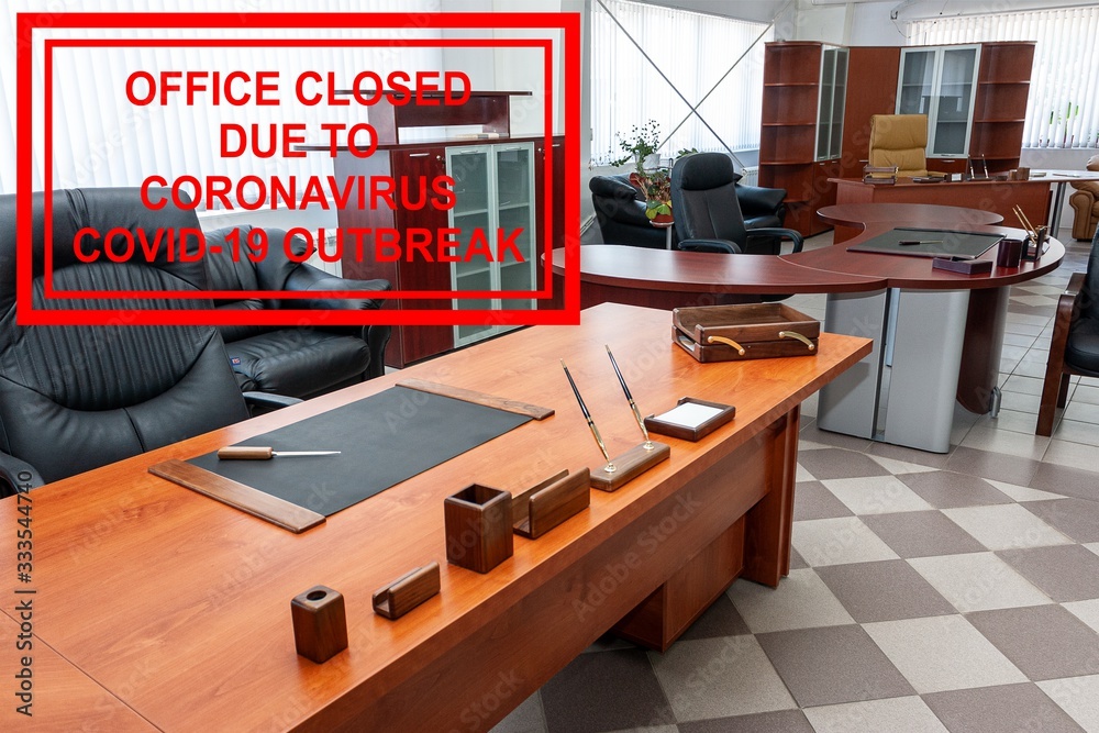 Modern office interior with a notice saying ''Office closed due to ...