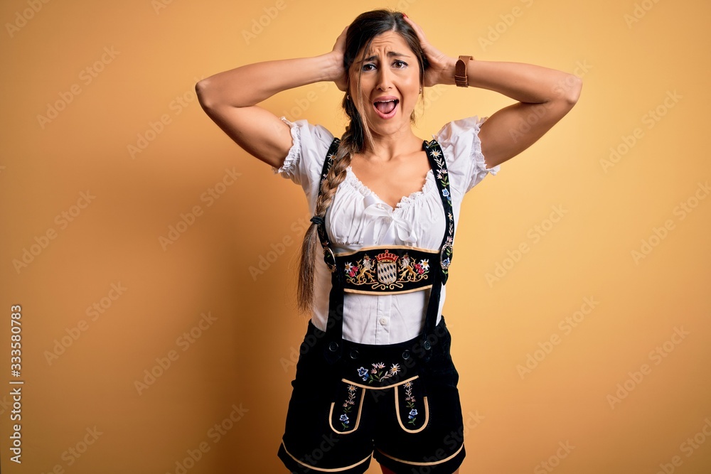 Young beautiful brunette german woman celebrating Octoberfest wearing ...