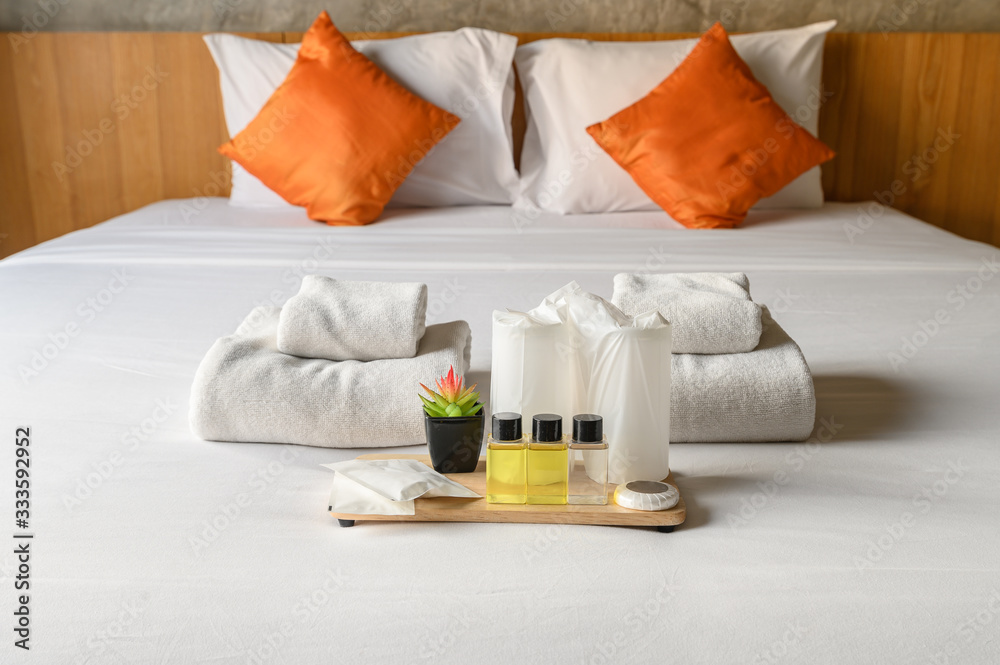 Set of hotel amenities (such as towels, shampoo, soap, drinking glass ...