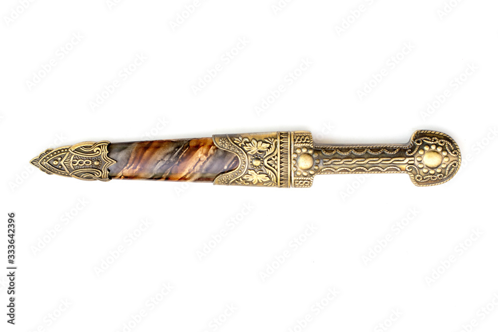 Ornate ceremonial dagger next to a jeweled scabbard Stock Photo | Adobe ...