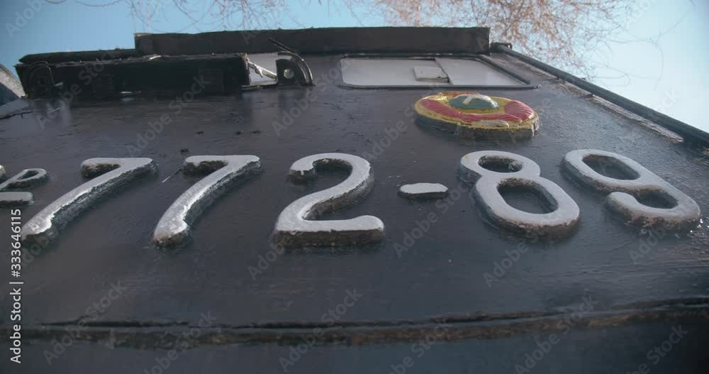 Serial Number on the side of the old black steam locomotive train with ...