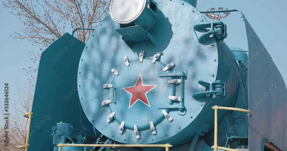 Old blue color steam locomotive train with a red star. Made in USSR ...