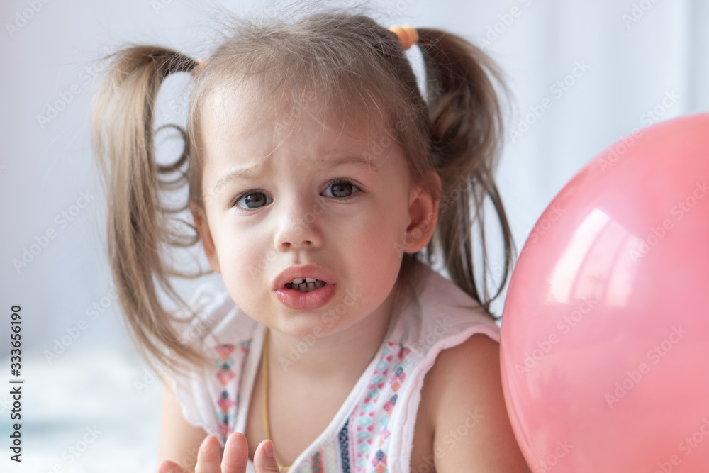 The sincere emotions of a little pretty girl. Emotional portrait of a ...