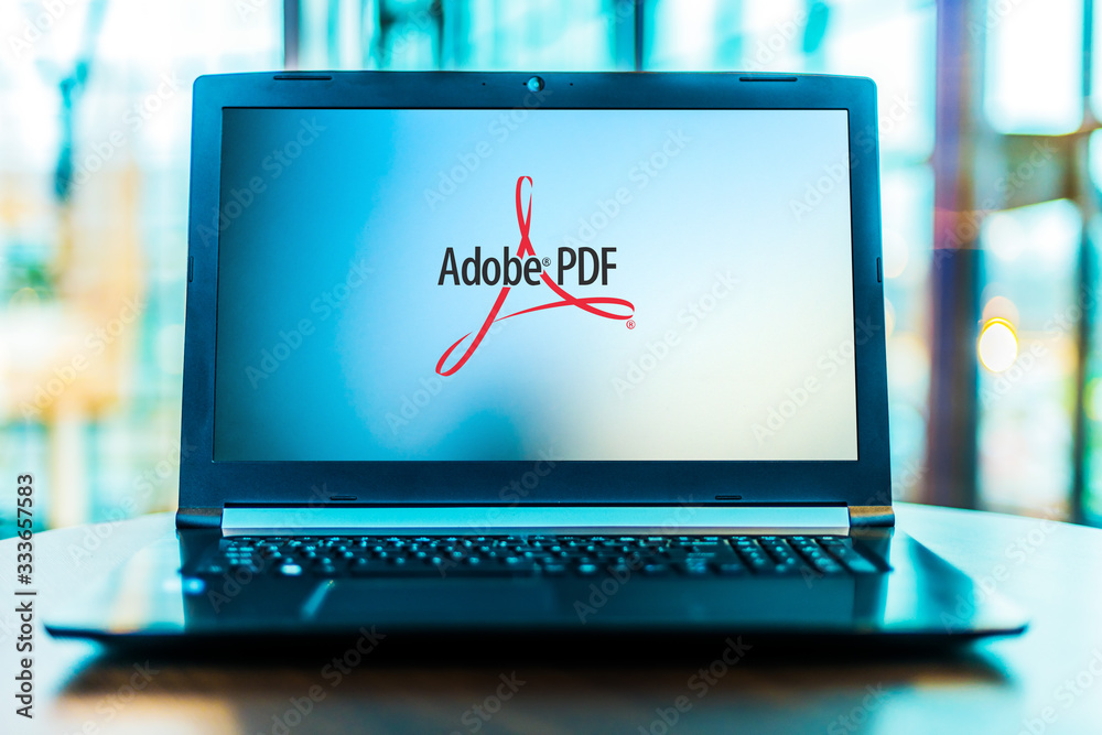 Laptop computer displaying logo of Adobe Acrobat Stock Photo | Adobe Stock