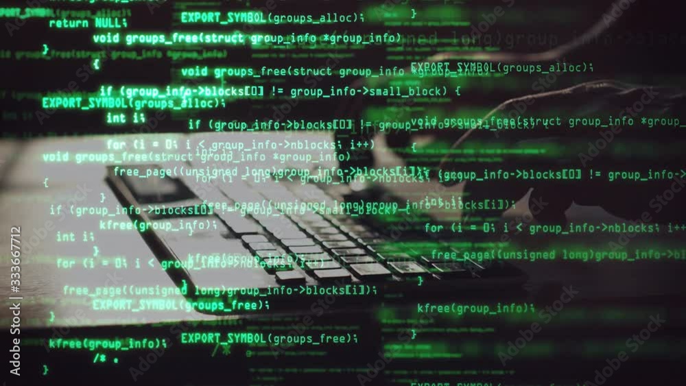 Male programmer types program code on laptop. Green source code overlay ...