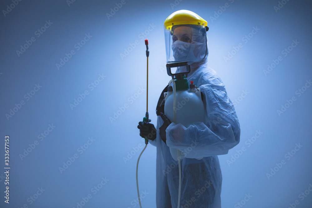 Scientist holding chemical sprayer for sterilization and ...
