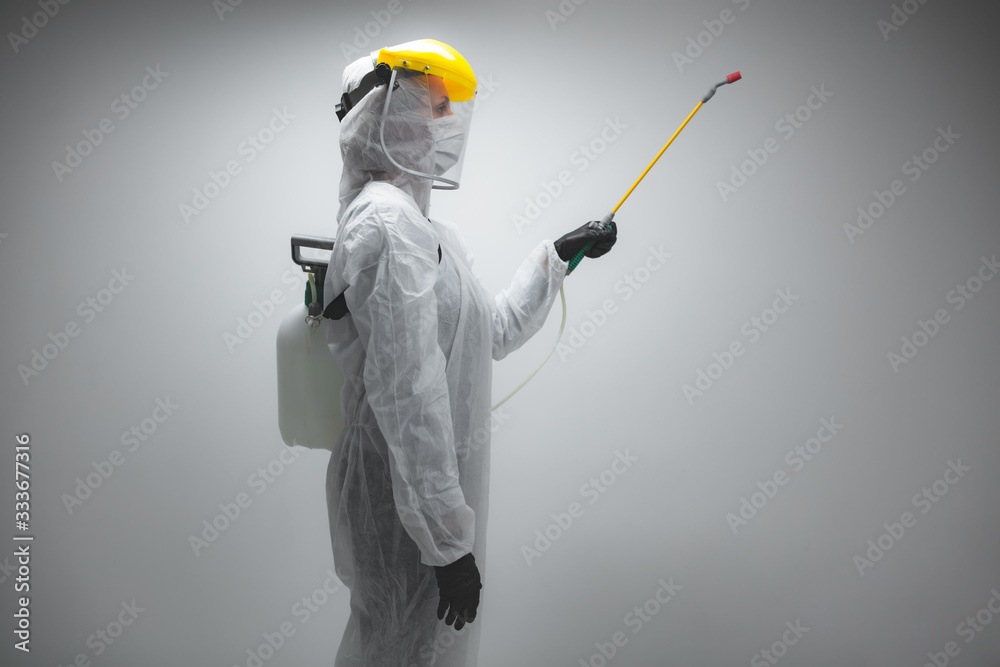 Scientist holding chemical sprayer for sterilization and ...