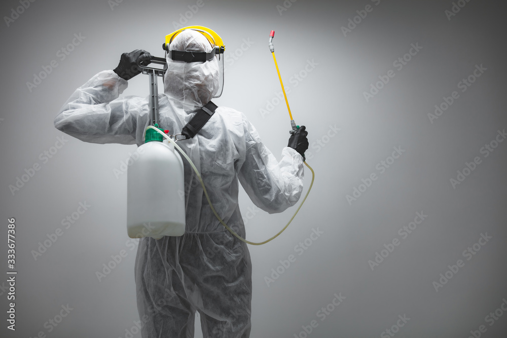Scientist holding chemical sprayer for sterilization and ...