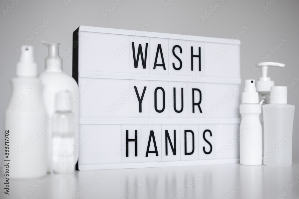 Foto de coronavirus pandemic and hand hygiene concept - light box with ...