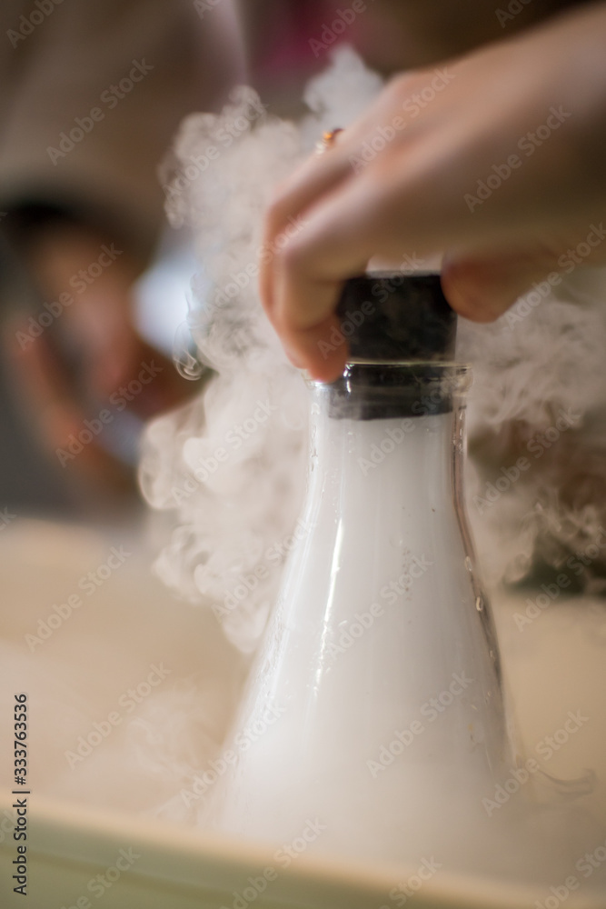 Experiments with dry ice for children. Smoke from the flask from ...