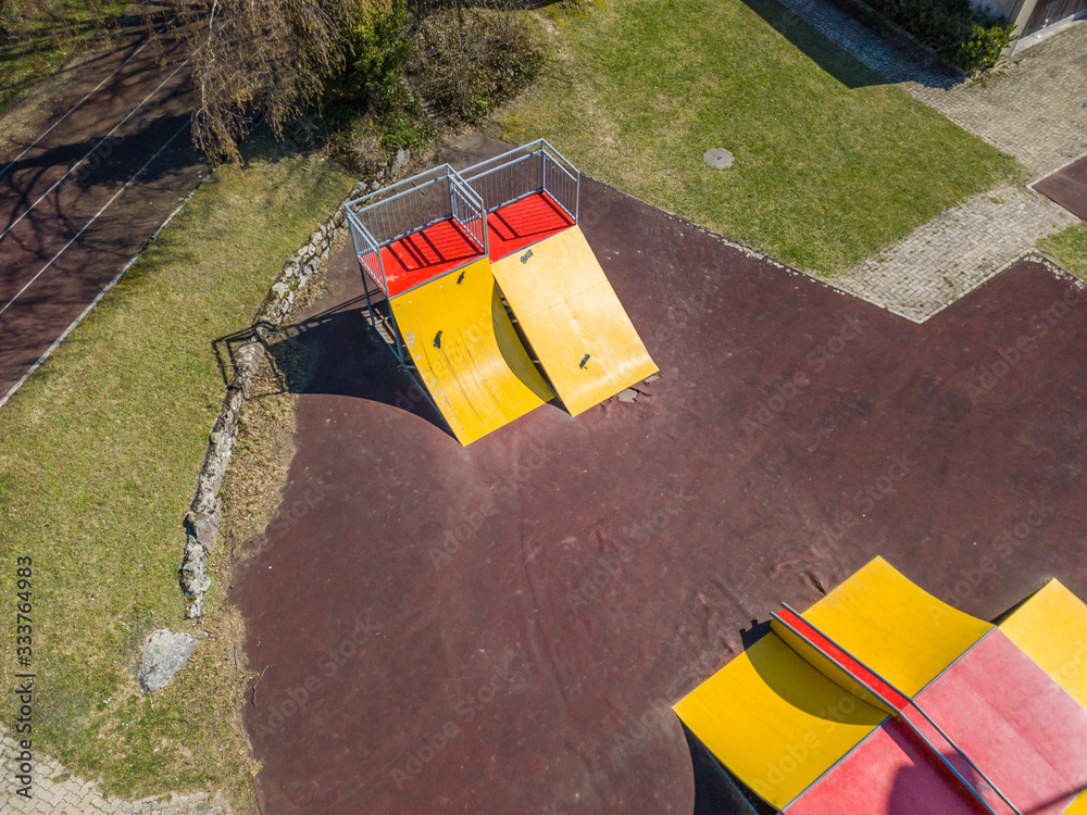 Aerial view of colorful skatepark with quarter pipe and ramp. Concept ...