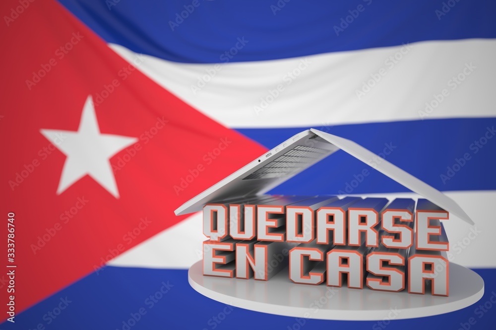 QUEDARSE EN CASA or STAY HOME text in Spanish under open laptop against ...
