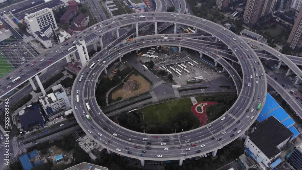 Circular junction at end of Nanpu bridge, aerial orbiting shot. Light ...