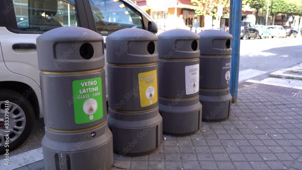 Grey plastic trash containers on the street in Rome, dustbins with ...