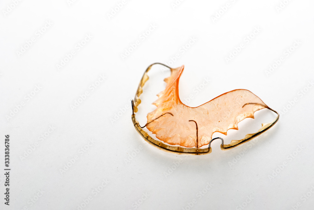 Old retainer on white table background Stock Photo | Adobe Stock