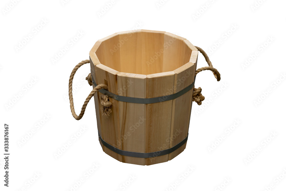 Wooden bucket with rope handles. They're going against a white ...