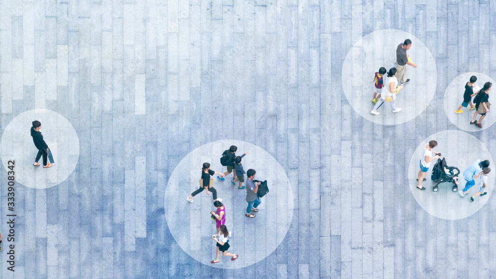 op view of social distance people are walking in public space on ...