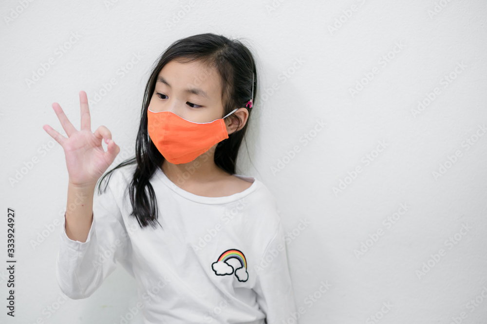 Coronavirus Covid-19 virus and Air pollution pm2.5.Asian child girl protect from virus stop ...