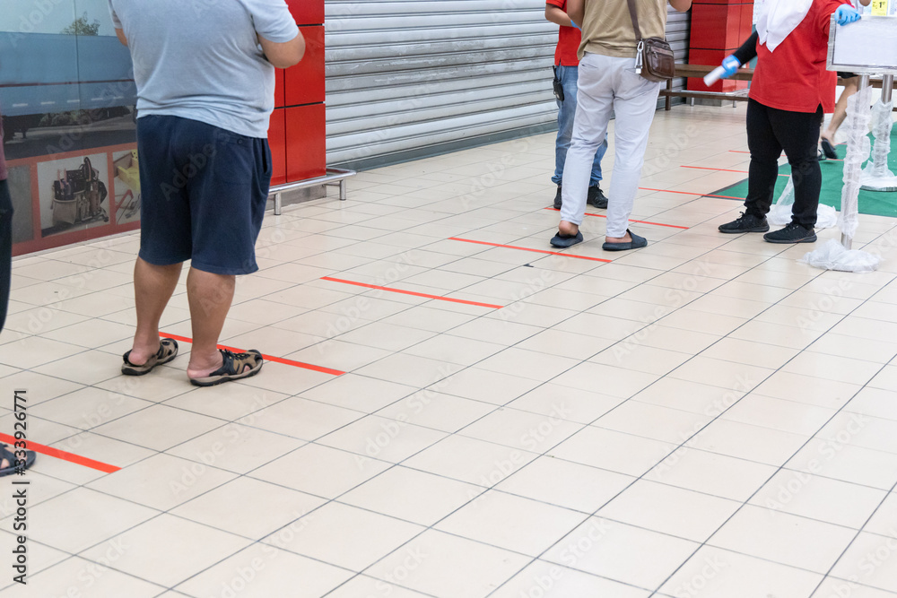 Social distancing being practiced at entrance to supermarket, with 1 ...