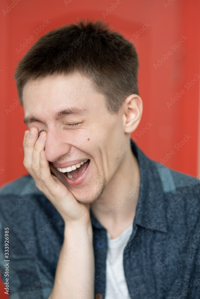 portrait of a cute guy with very bright facial expressions and emotions ...