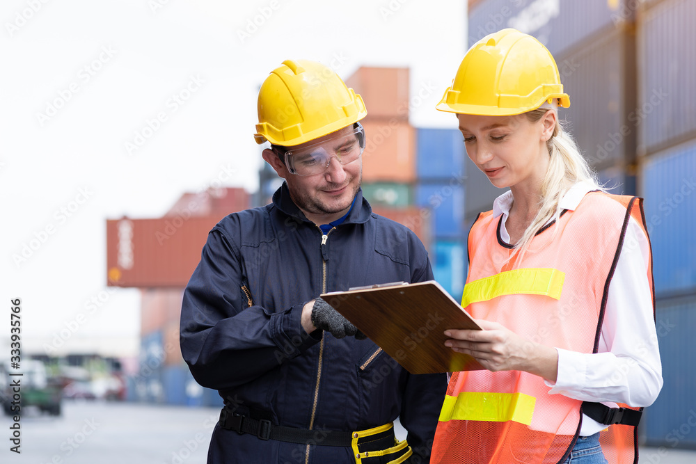 Portrait of foreman or supervisor in uniform and wearing yellow safety ...