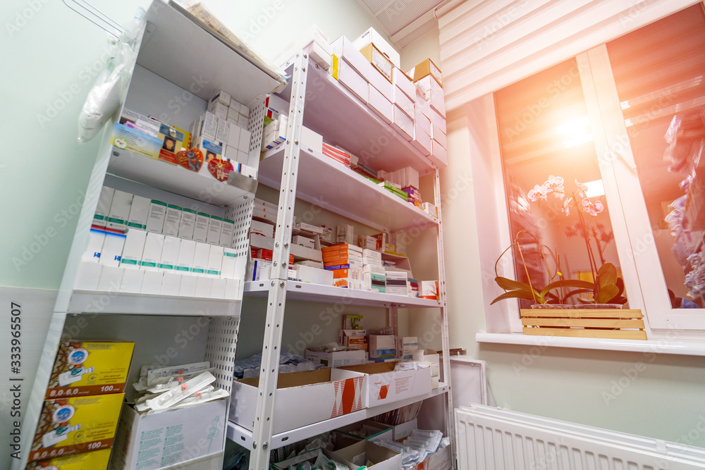 Shelves of medical remedies in storeroom. Emergency set. Sanitizer ...