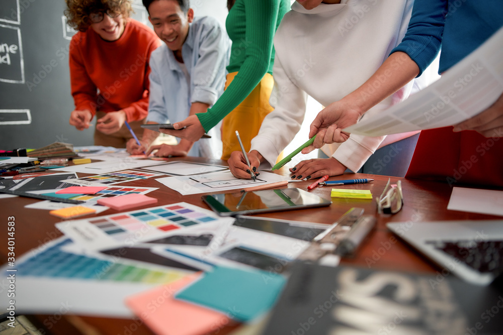 Graphic design team. Cropped photo of creative people prototyping new ...