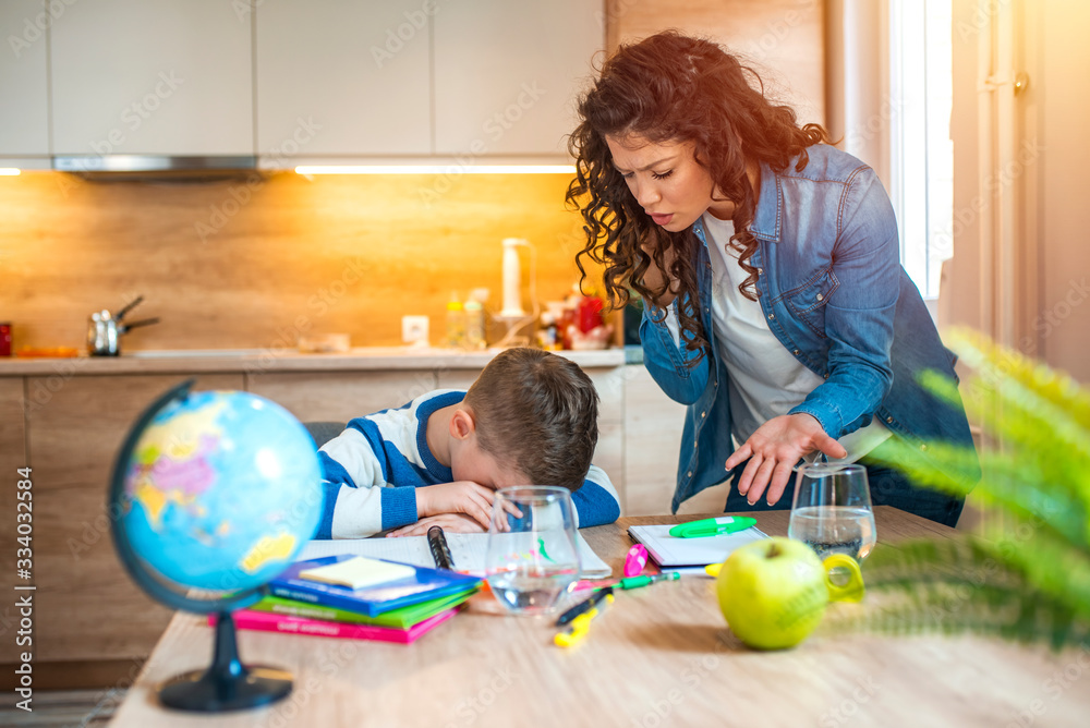 Child having problem with concentration while doing homework. Stressed ...