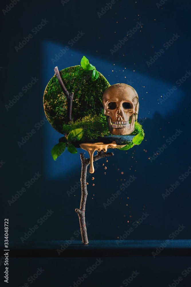 Golden scull with moss and branches, live and death concept in ...