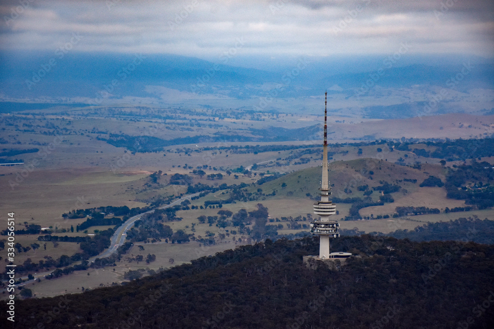 Aerial view over Canberra of Telstra Tower sunrise from hot air balloon ...