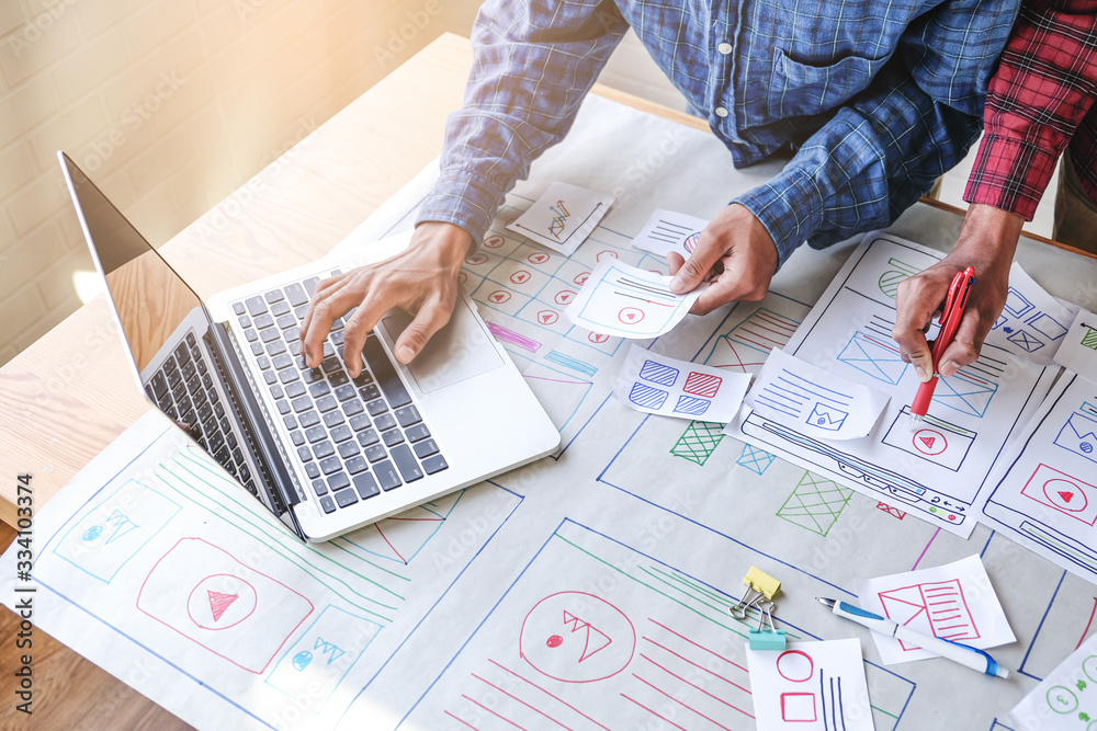 close up male asian ui/ux designers working and designing a user ...