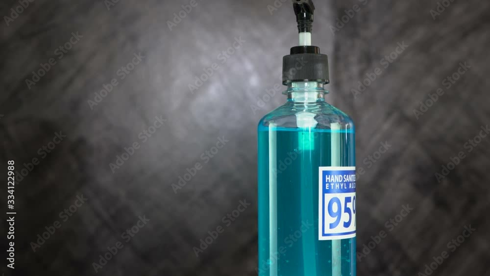 Bottle of hand sanitizer blue gel with ingredient ethyl alcohol 95% on ...