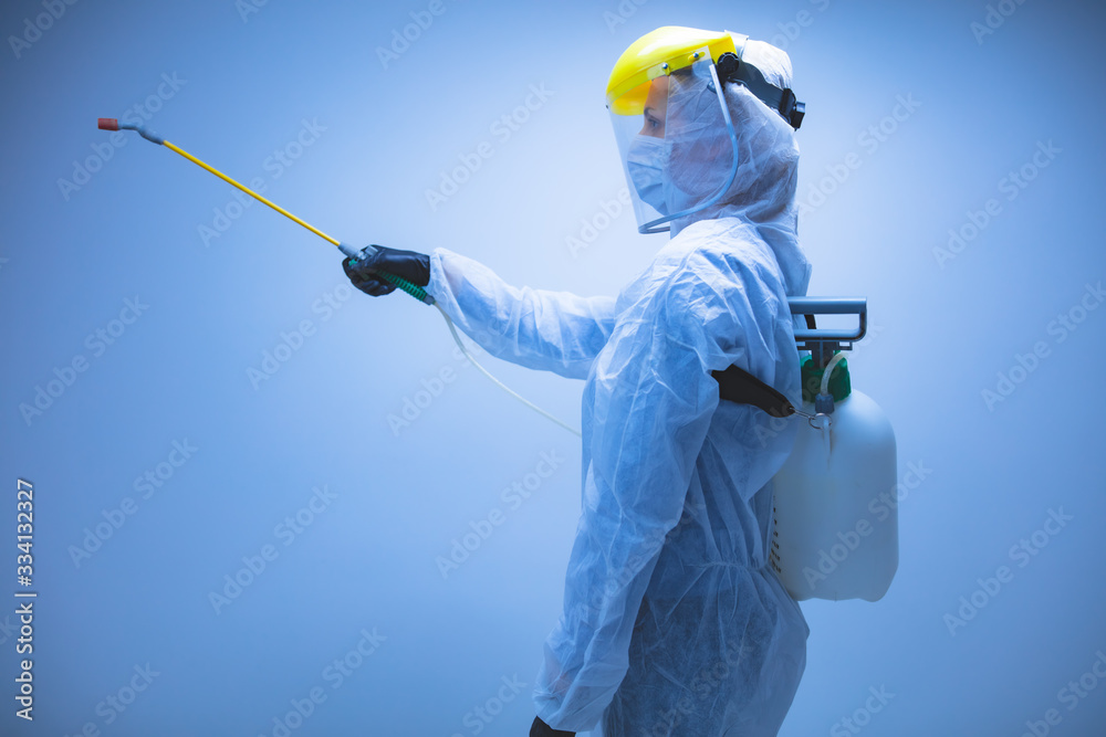 Scientist holding chemical sprayer for sterilization and ...