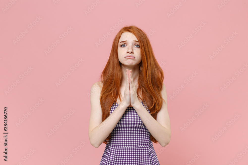 Pleading young redhead woman girl in plaid dress posing isolated on ...