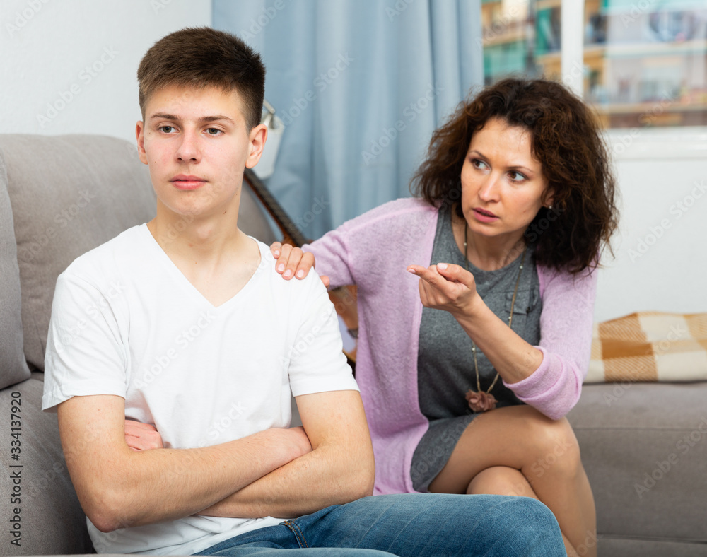 Worried mother talking to son Stock Photo | Adobe Stock