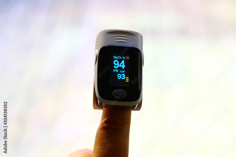 Pulse oximeter measuring oxygen saturation in blood and heart rate ...