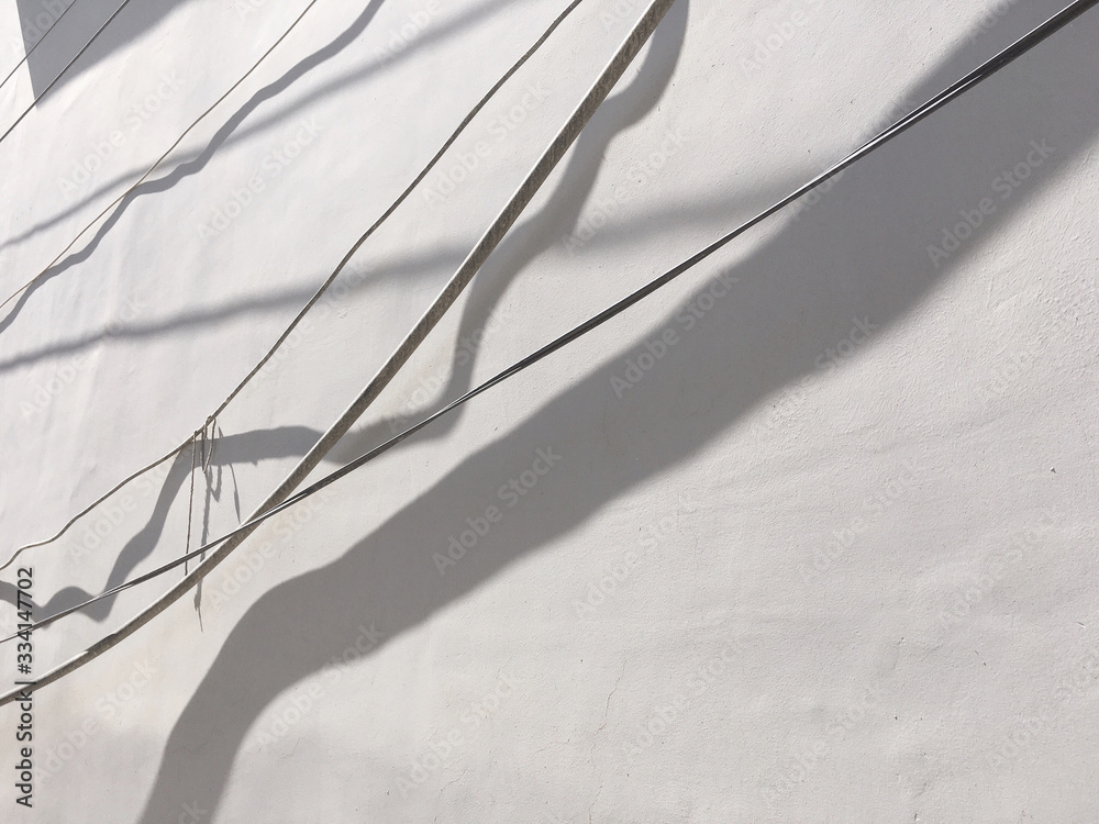 Double line of light and shadow on white wall. Stylish and minimalistic ...