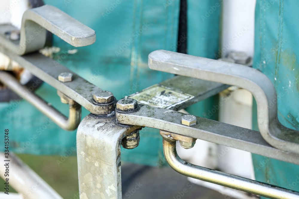 Close-up of a metal gate linkage system seen on a professional race ...