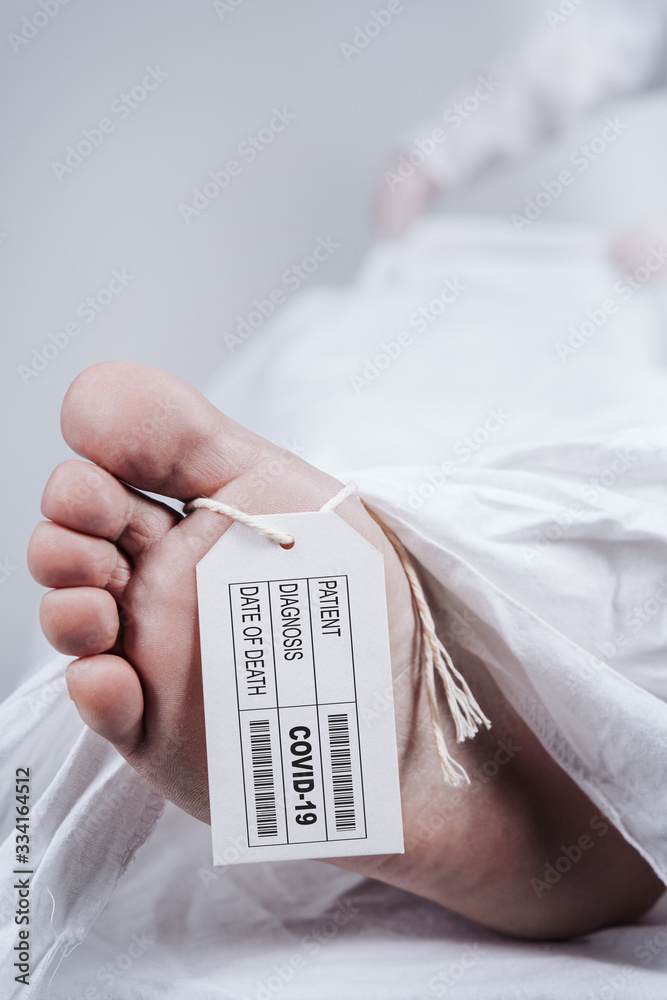 Feet of a dead body, with an identification tag. Deceased's data on ...