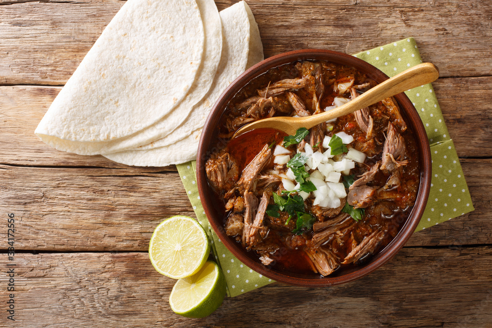 Mexican style slow cooked beef stew Birria de Res served with lime and ...