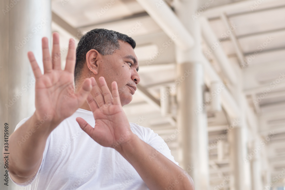 old man showing rejecting, stopping hand gesture; concept of forbidding ...