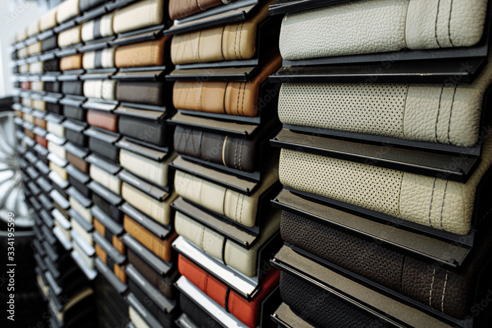 auto paint samples of different colors at car dealership showroom ...