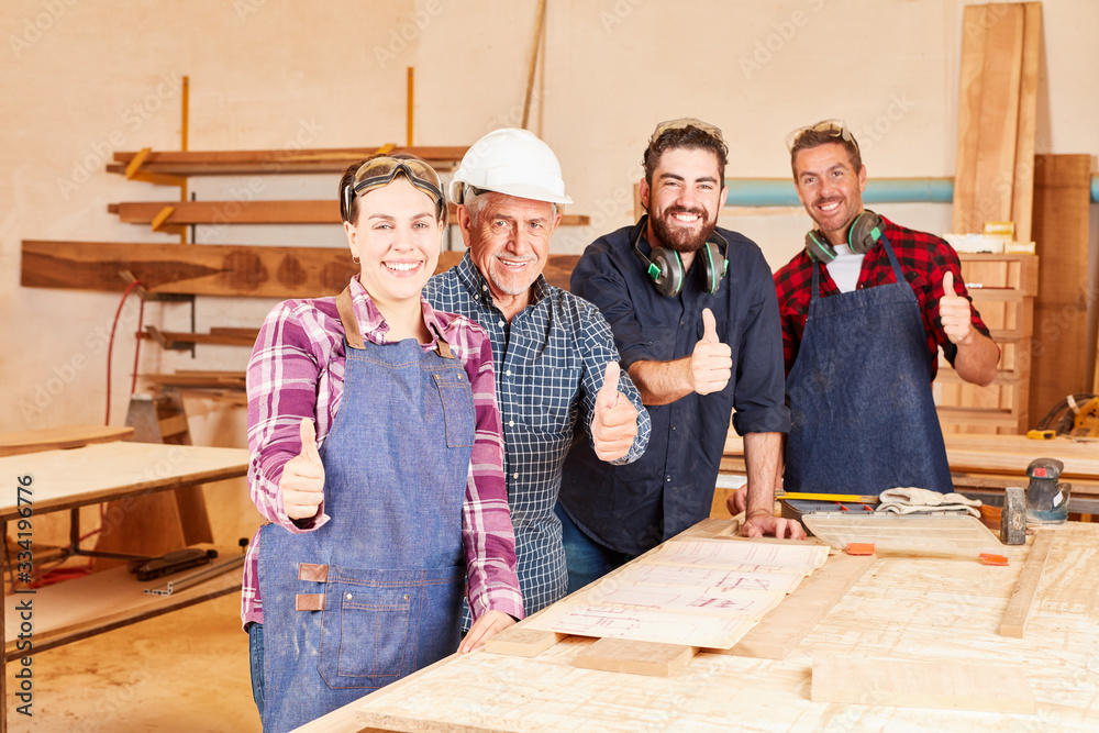 Successful craftsman team with trainee Stock Photo | Adobe Stock