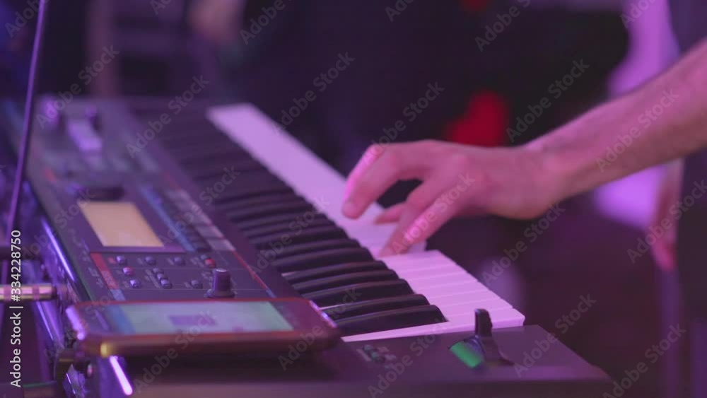 Pianist Musician Performs Live Keyboard Game In A Band. A musician ...