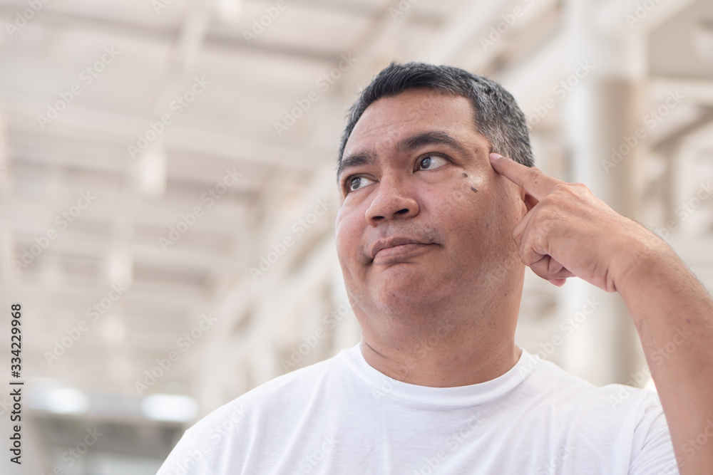 smart thoughtful asian old senior man thinking, planning; portrait of ...